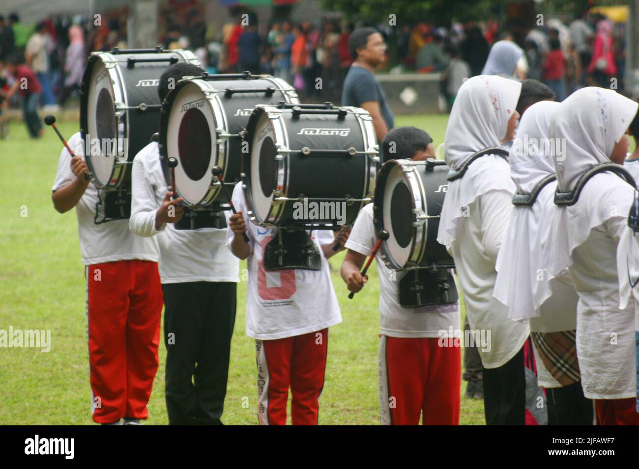 some students are practicing marching band with various musical ...