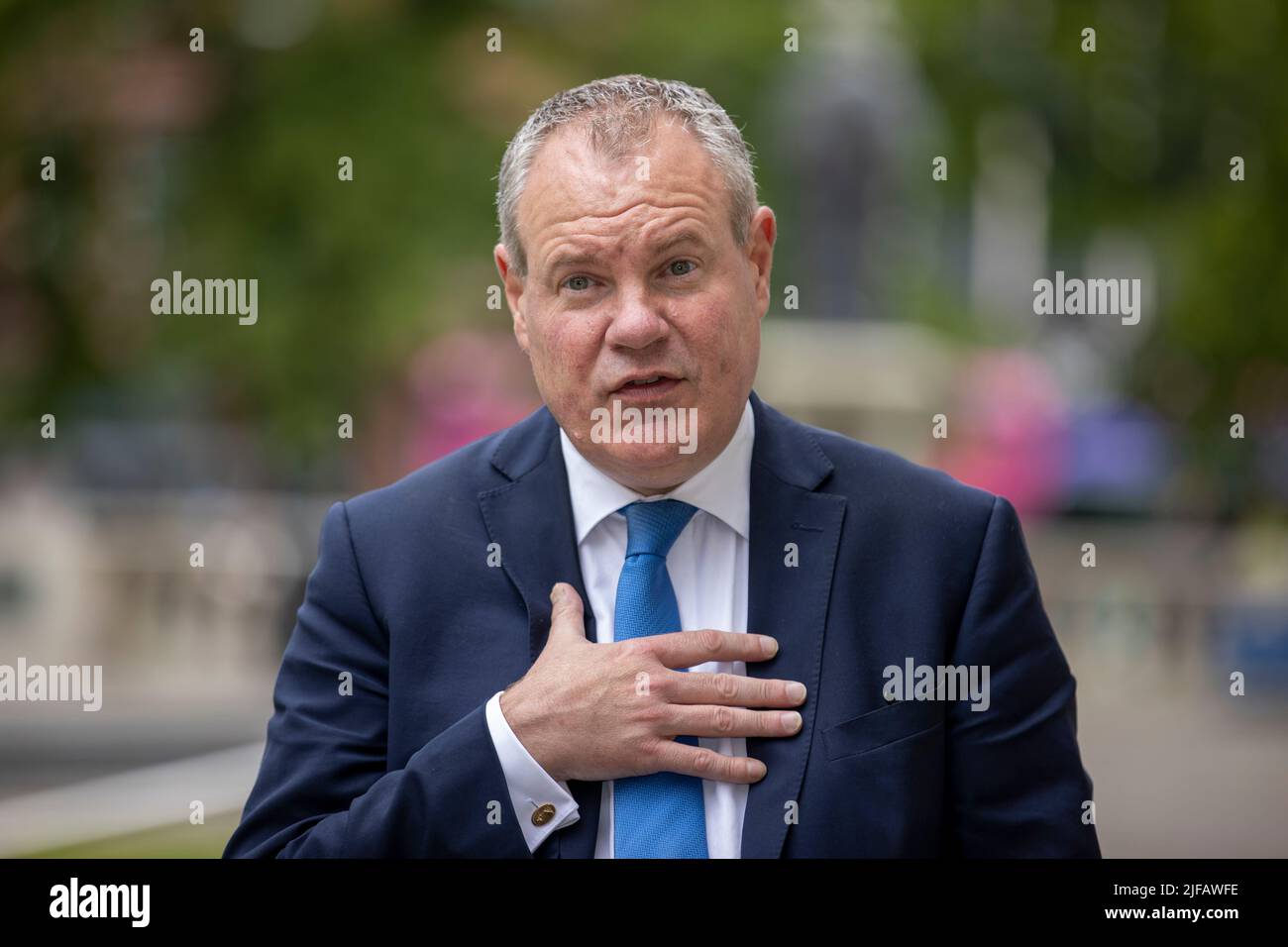 Minister of State for Northern Ireland Conor Burns speaks to the media ...