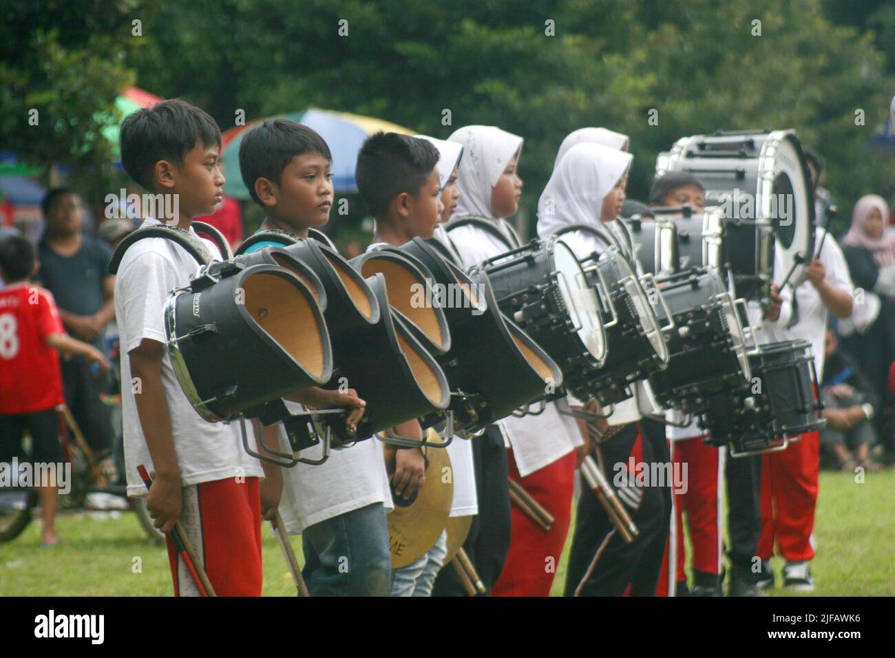some students are practicing marching band with various musical ...