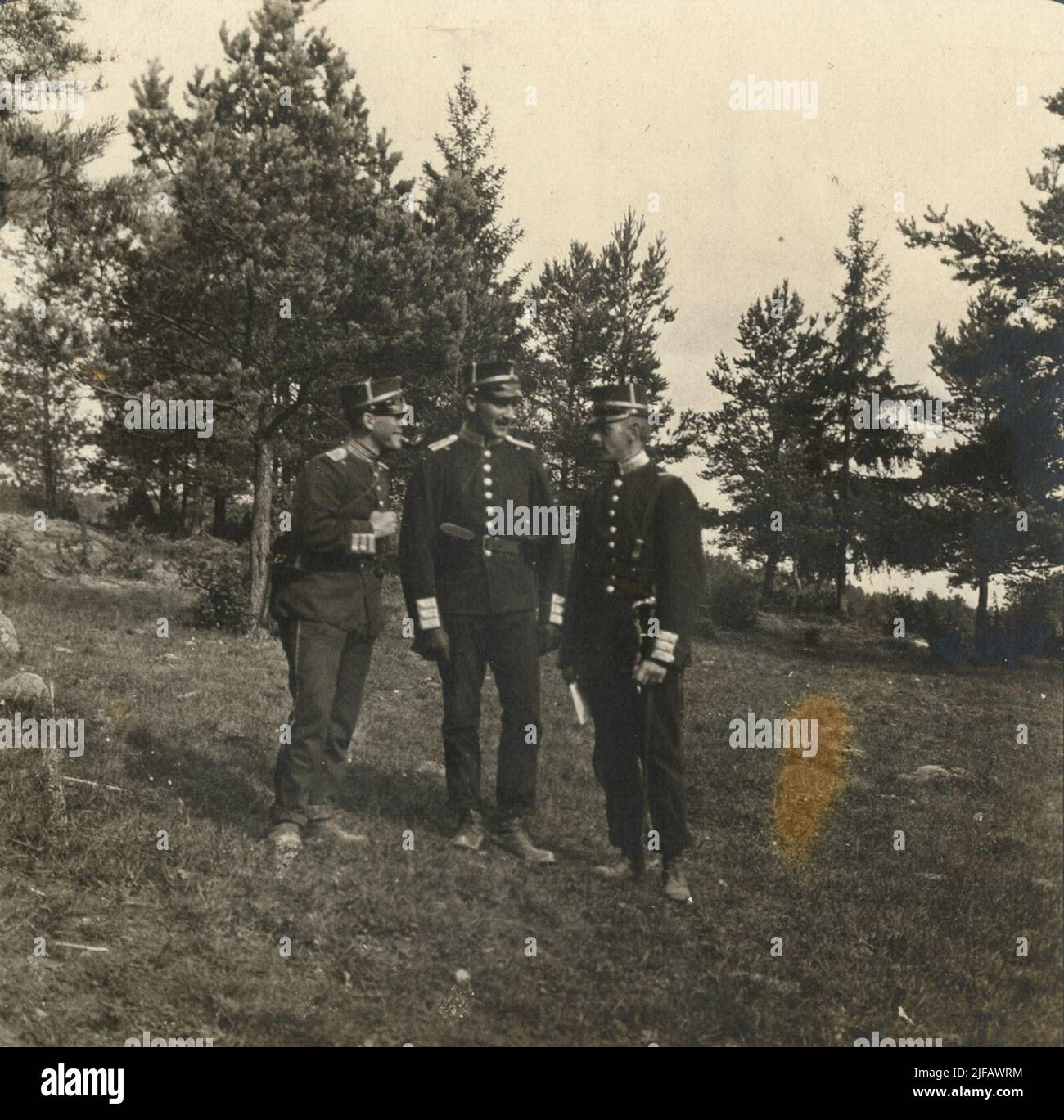 Three soldiers talk in the field Stock Photo - Alamy