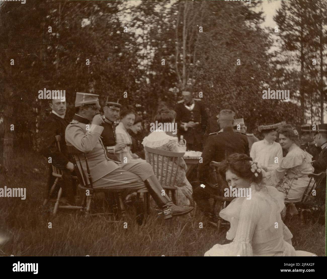 Society enjoy refreshments in the garden Stock Photo - Alamy