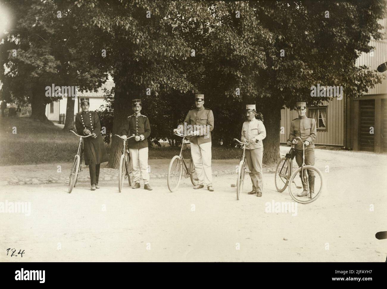 Officers with bicycles. The photograph is included in albums containing ...