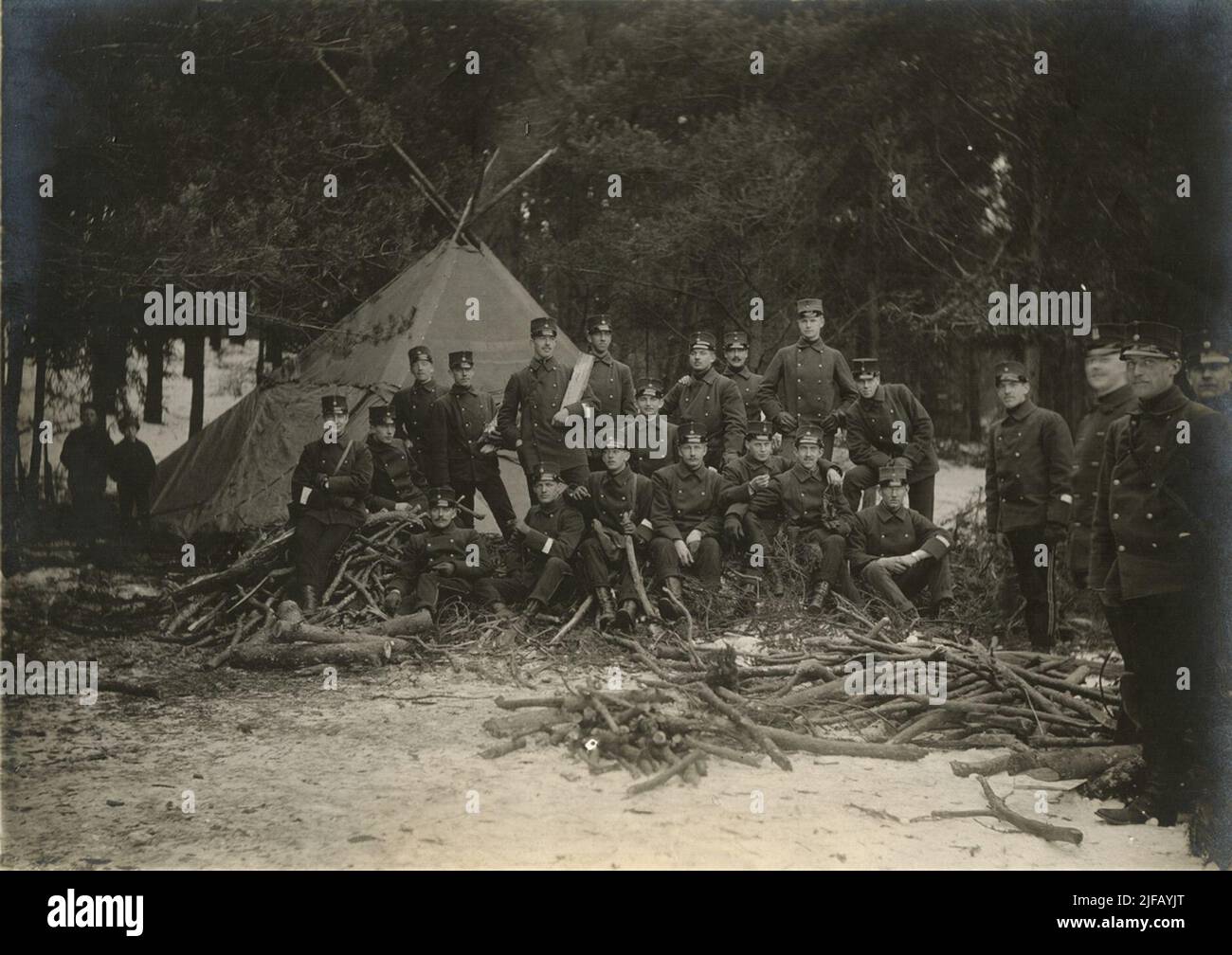 Soldiers gathered in front of tents. Soldiers gathered in front of ...