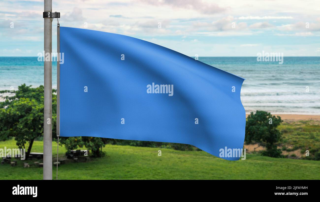 Blue flag mockup for you design on coast with sandy beach and green ...