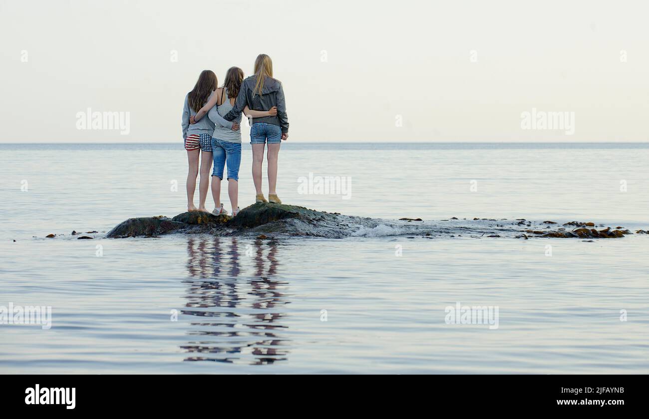 Friends on an islet Stock Photo - Alamy