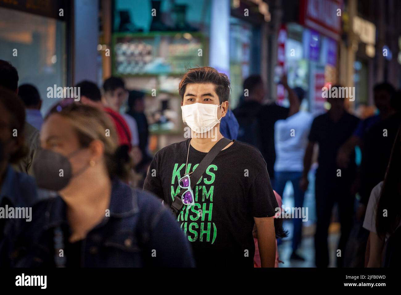 Picture of an young man wearing a respiratory face mask in the ...