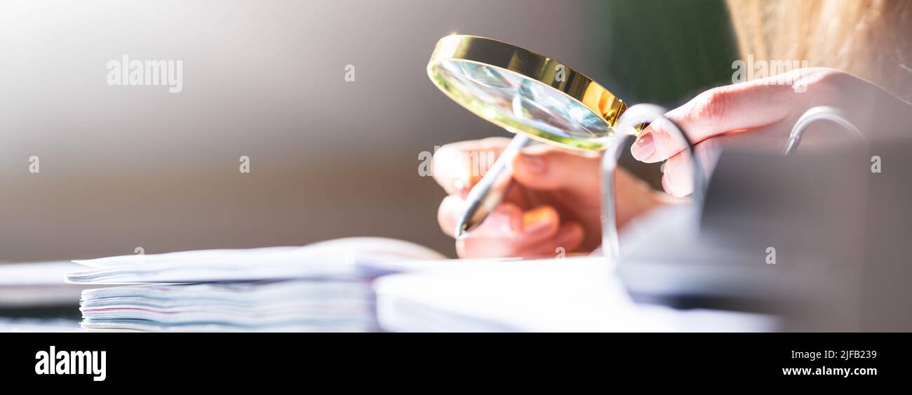 Auditor Using Magnifying Glass For Audit And Fraud Investigation Stock ...