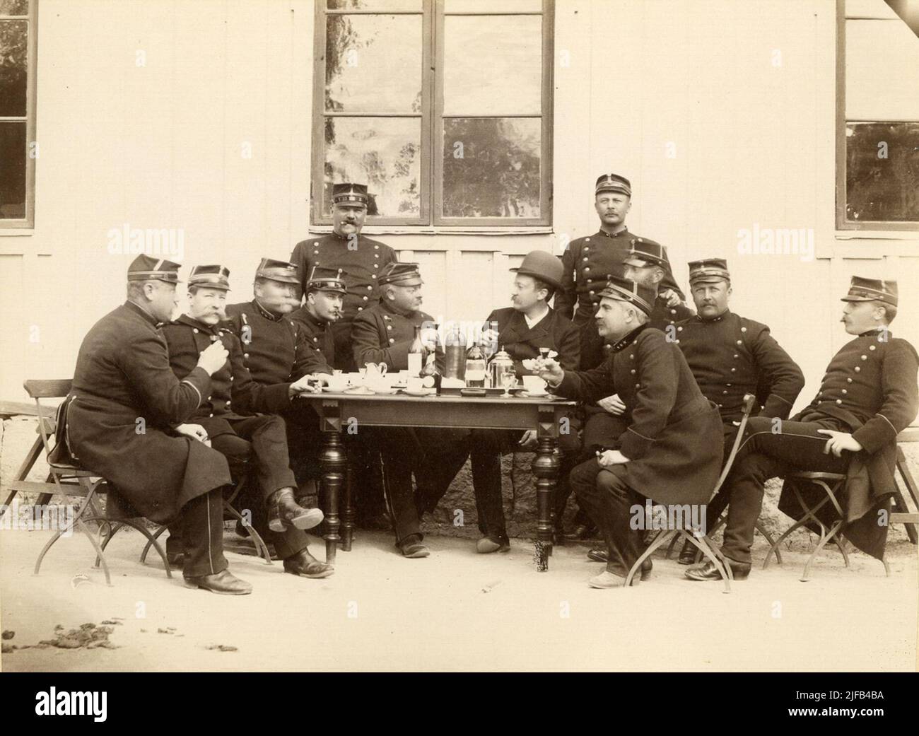 Officers sit at the table drinking coffee Stock Photo - Alamy