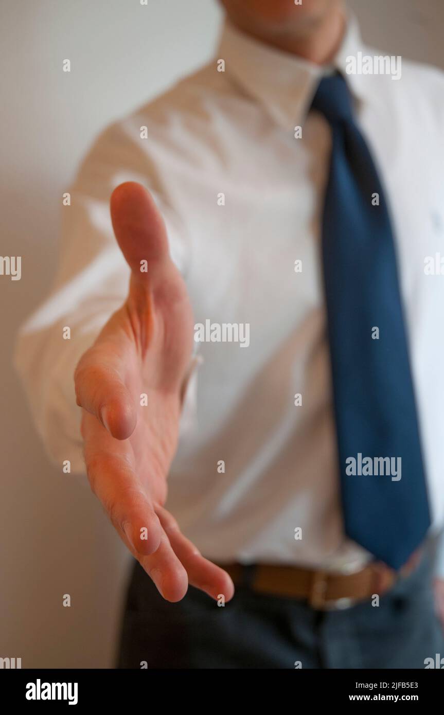 Man extending his open hand, offering handshake Stock Photo - Alamy