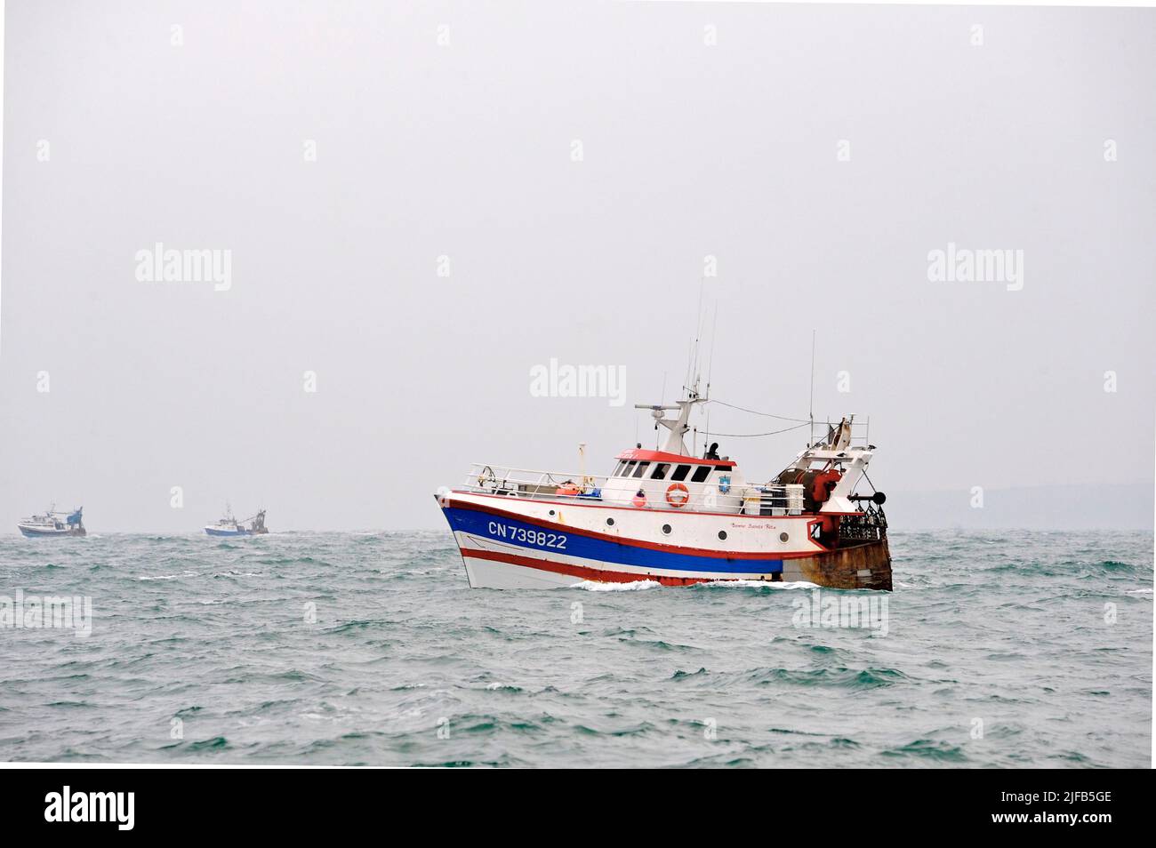 France, Calvados, trawler fishing for scallops in the bay of the Seine ...