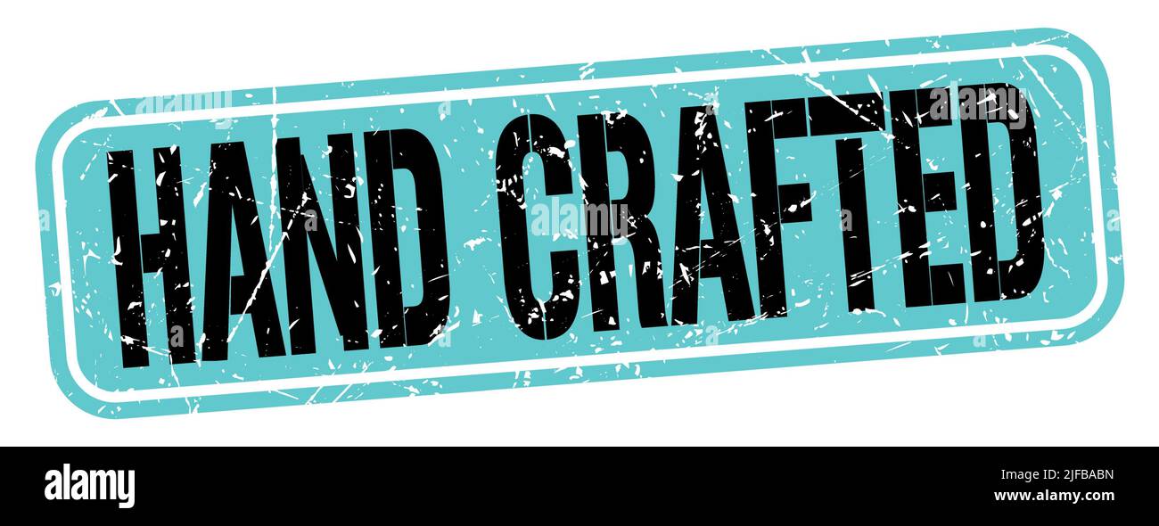 HAND CRAFTED text written on blue-black grungy stamp sign Stock Photo ...