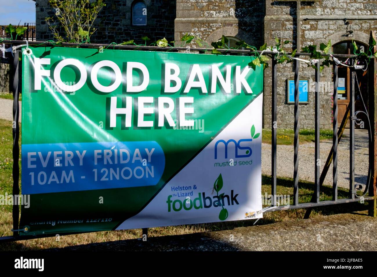 Sign for the weekly Food Bank in Mullion Village in Cornwall, UK Stock ...