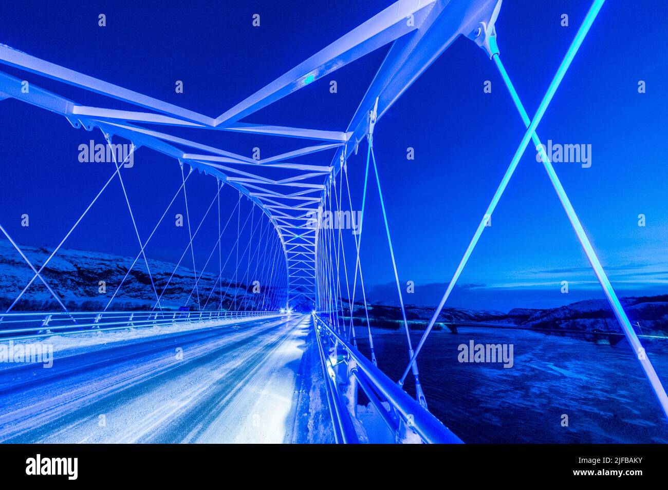 Norway, Lapland, County of Finnmark, Elvenes, illuminated bridge on the ...