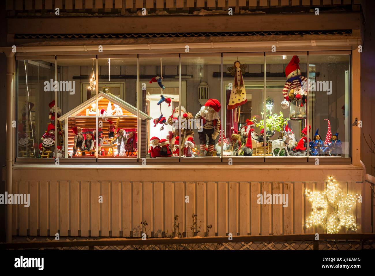 Norway, Lapland, County of Finnmark, Kirkenes, window illuminated with ...
