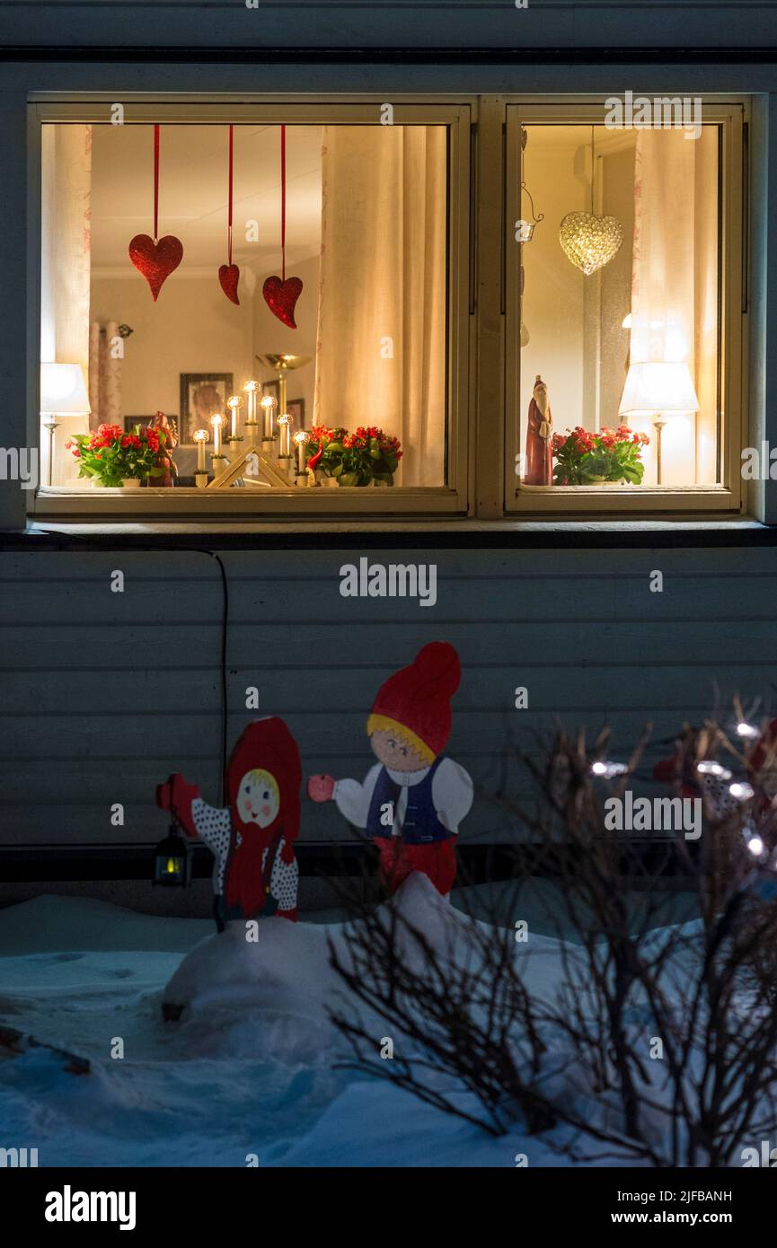 Norway, Lapland, County of Finnmark, Kirkenes, window illuminated with ...