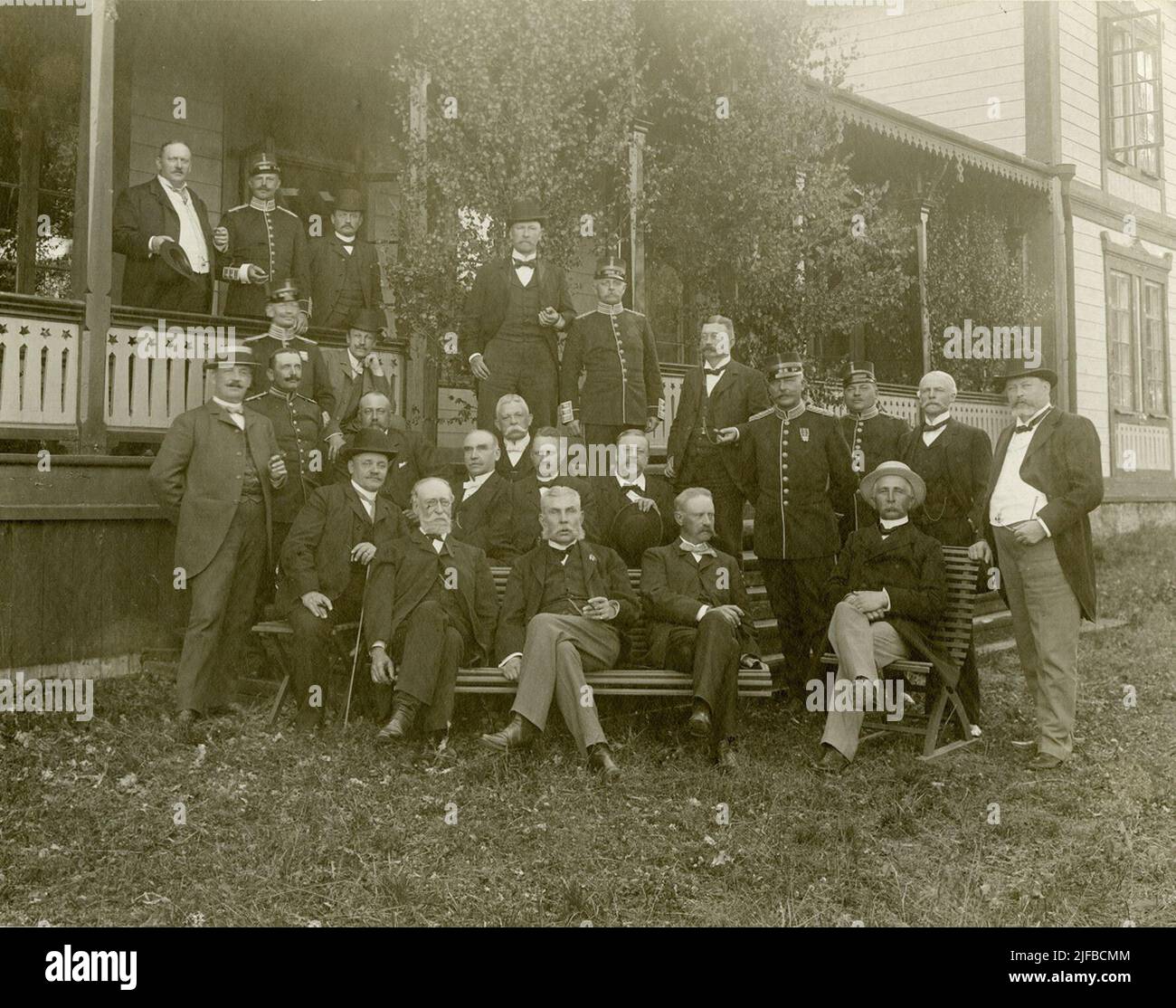 Group portrait of officers and civilian -clad men. Group portrait of ...