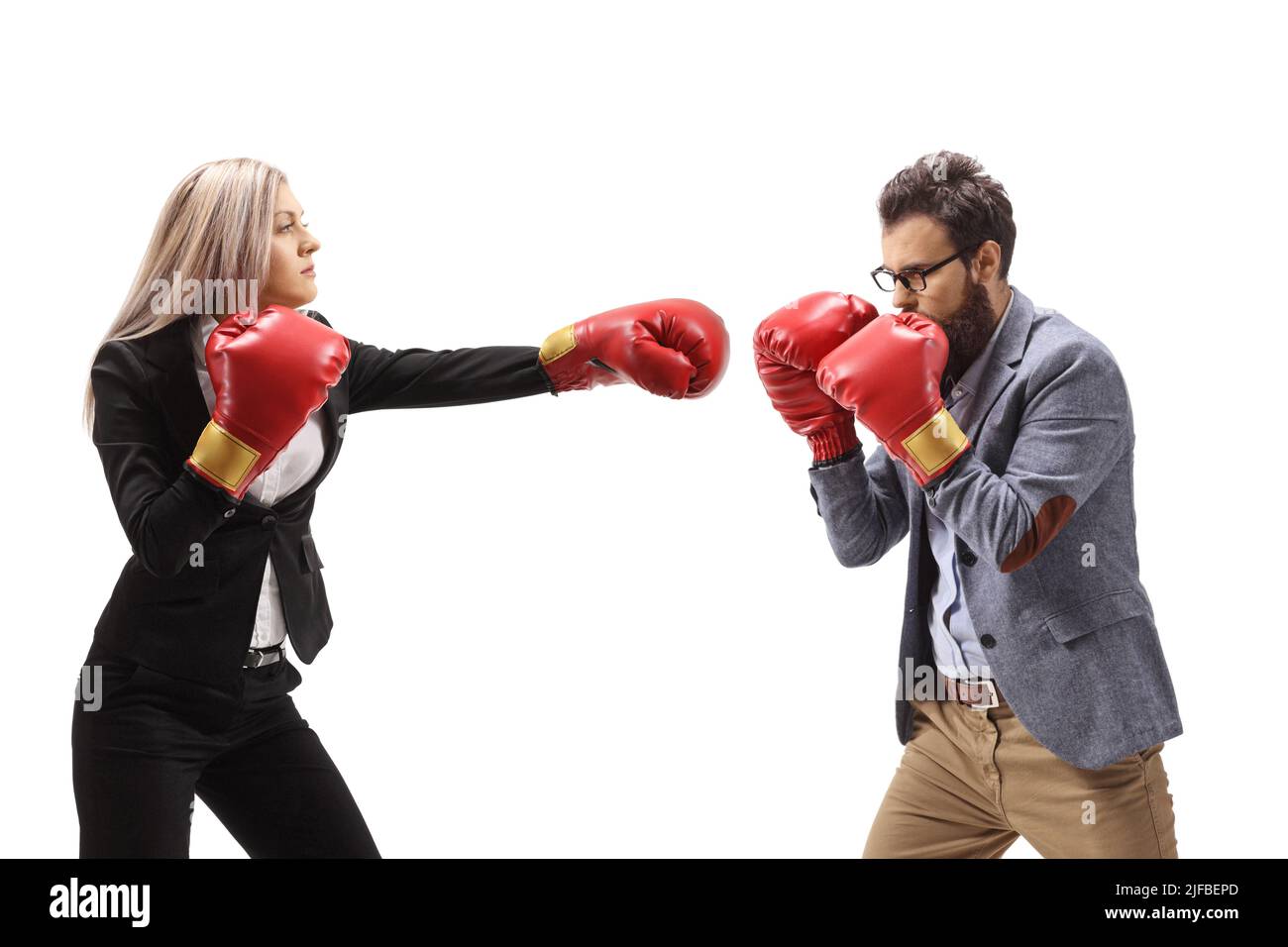 Profile shot of a man and woman in formal clothes fighting with boxing ...