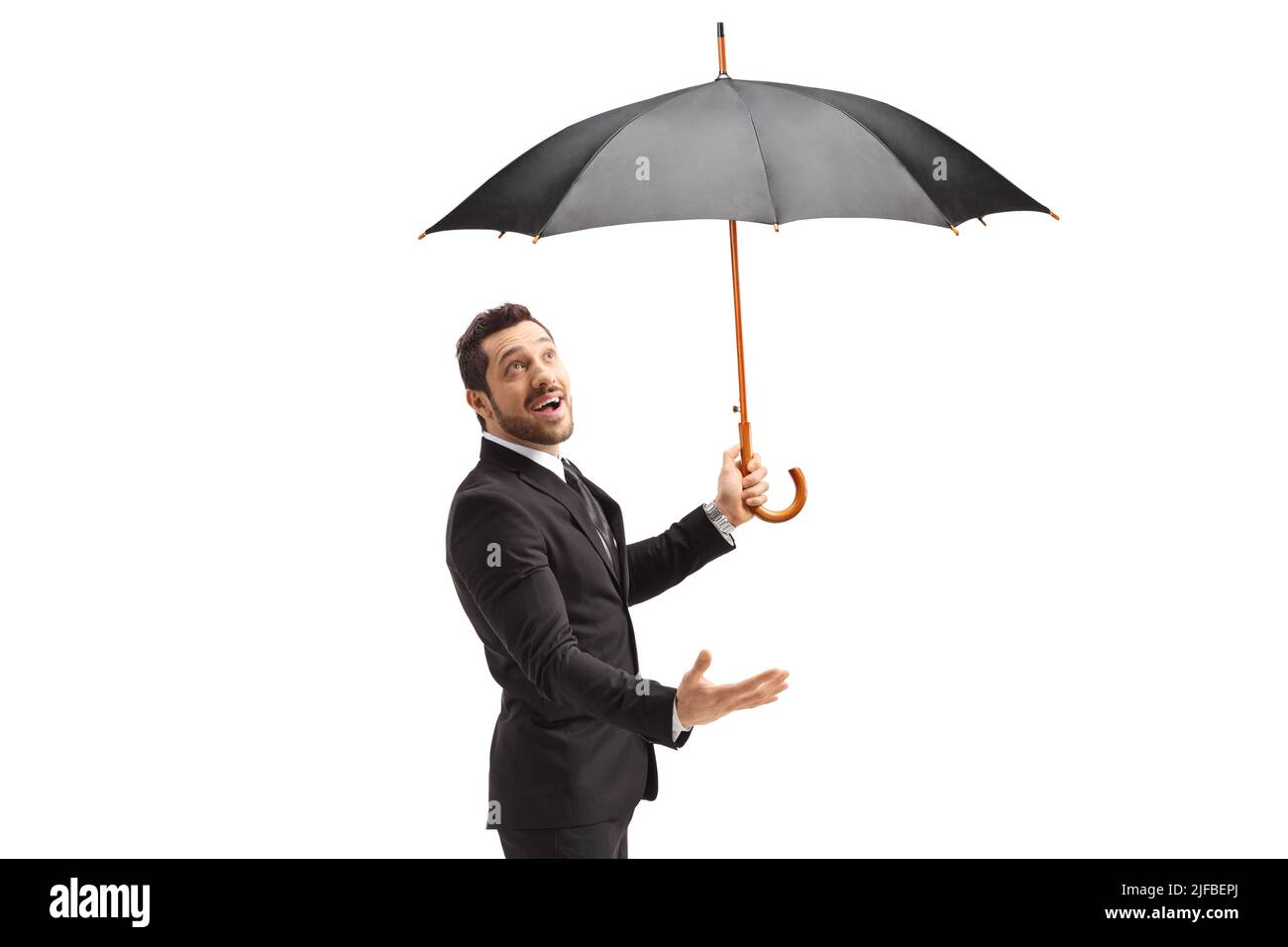 Businessman with umbrella checking weather isolated on white background ...