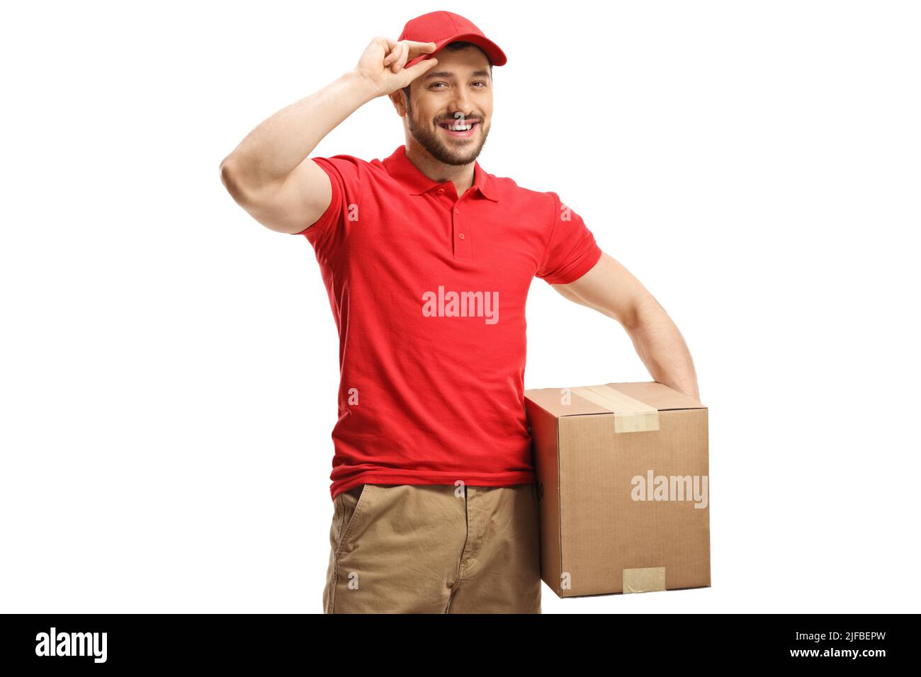 Delivery man with a box smiling and greeting with cap isolated on white ...