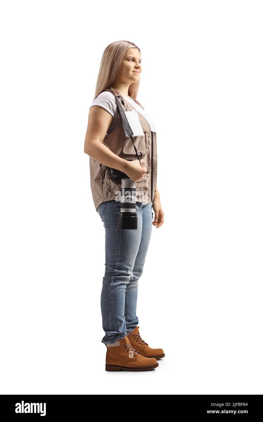 Full length shot of a female photo journalist carrying a camera on her ...