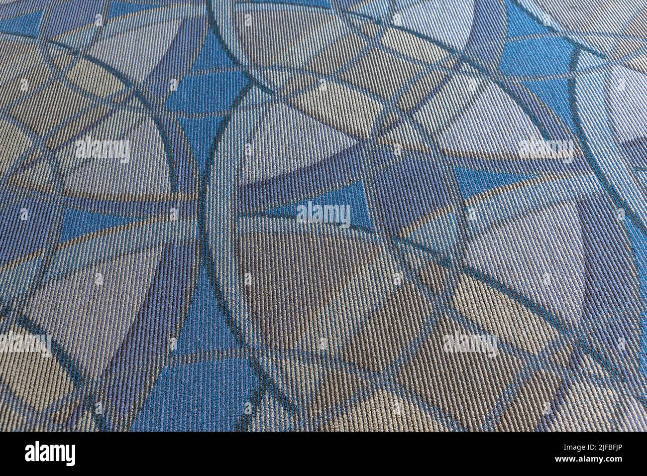 A blue and gray outdated geometric pattern large floor carpet Stock ...