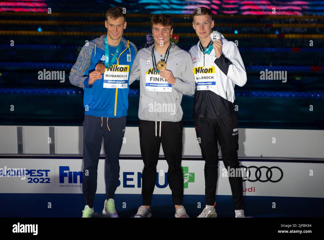 Florian Wellbrock of Germany , Bobby Fink of USA and Mykhailo Romanchuk ...