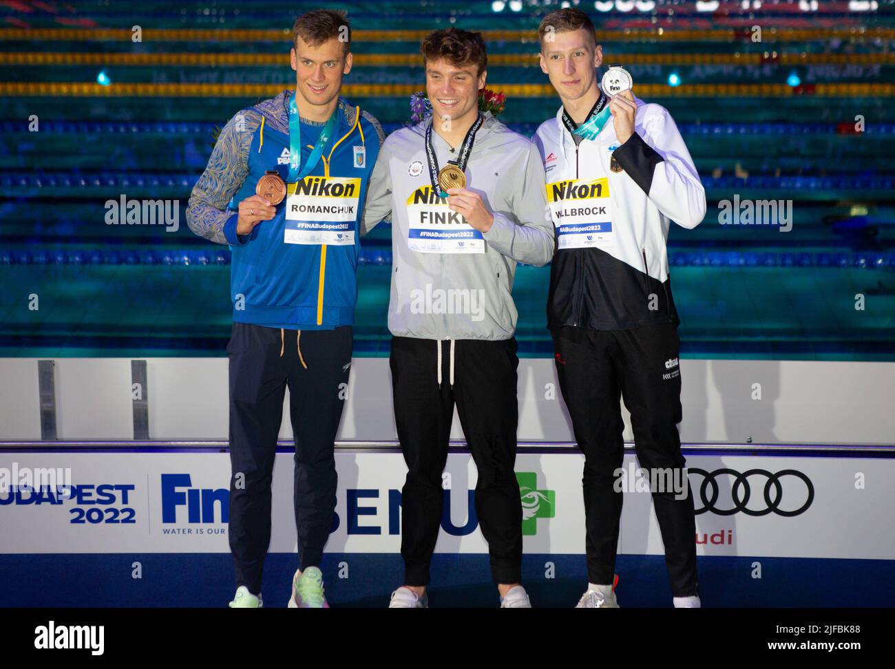 Florian Wellbrock of Germany , Bobby Fink of USA and Mykhailo Romanchuk ...
