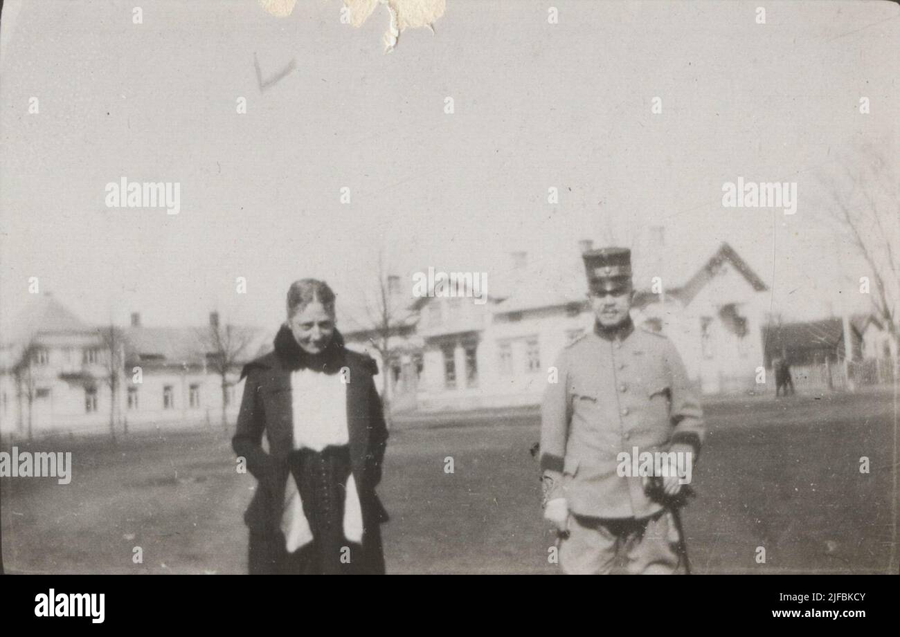 Two people in front of a building. Two people in front of a building ...