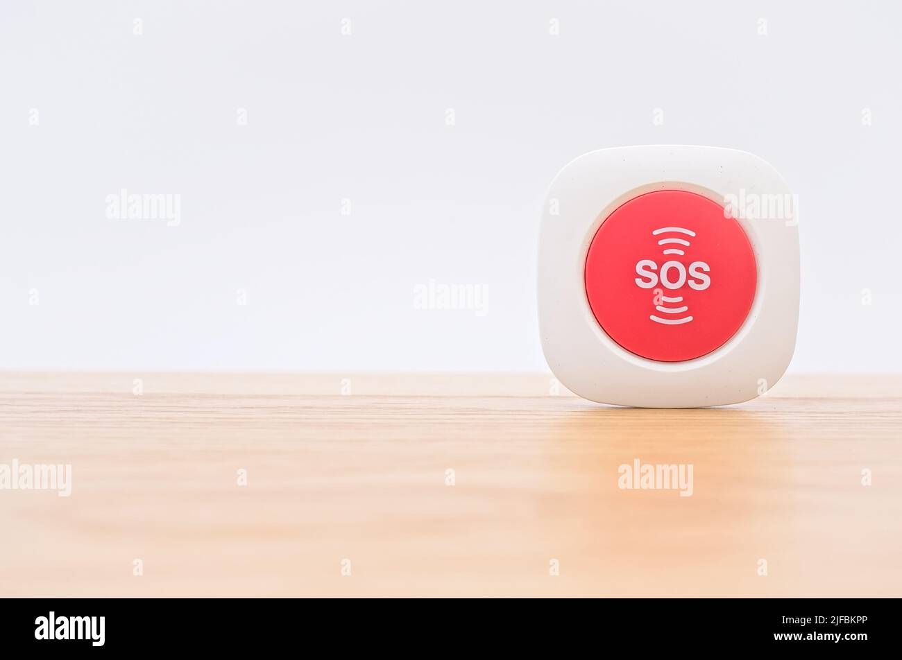 device with red SOS button - help request and danger concept Stock ...