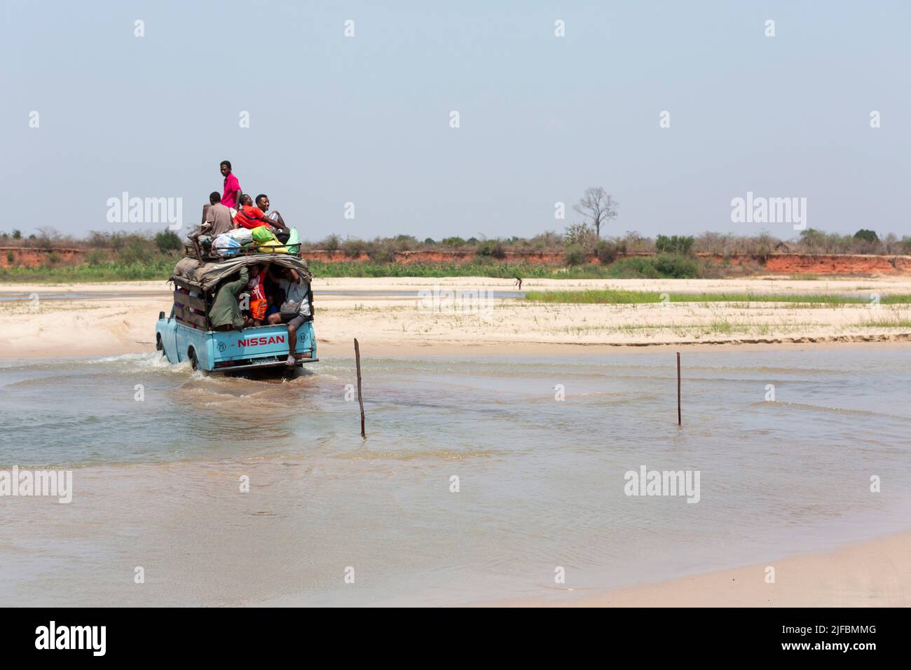 Madagascar, Menabe region, Morondava, passage of a river by bush taxi ...