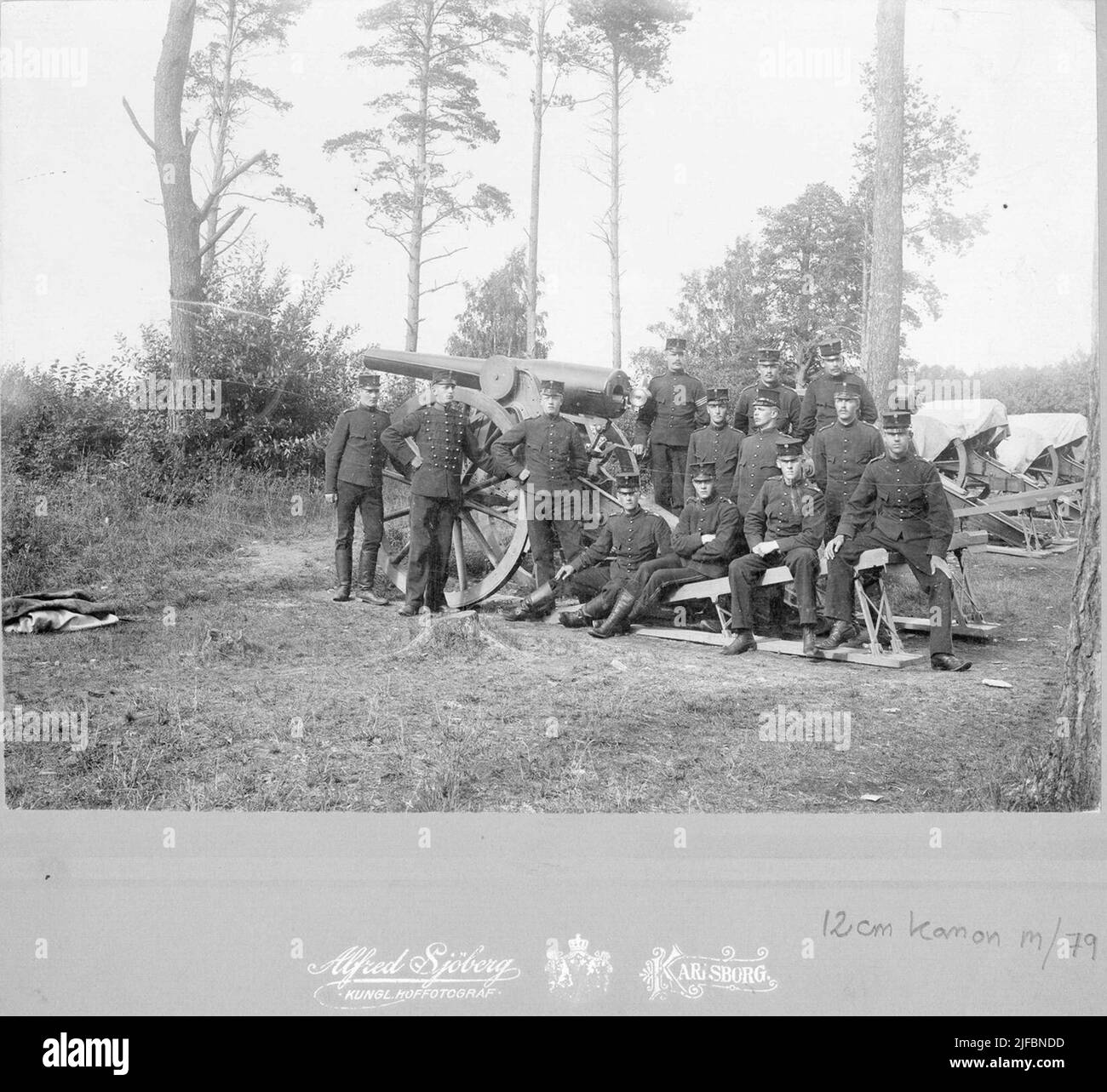 Thirteen soldiers poses at a 12 cm positioning play piece m/1879, in ...