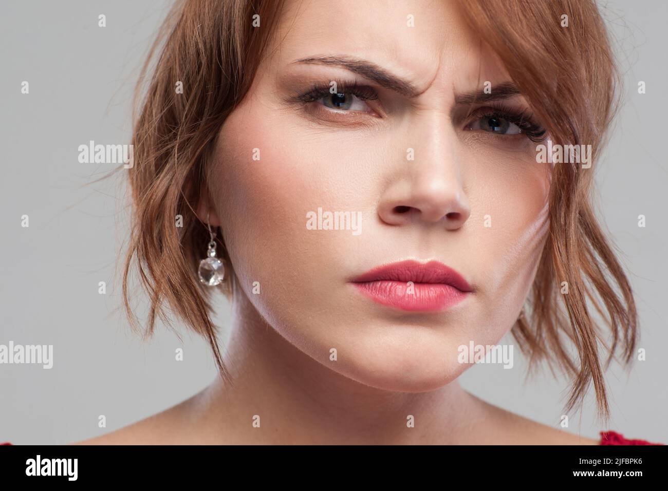 Suspicious look. Distrust in partner Stock Photo - Alamy