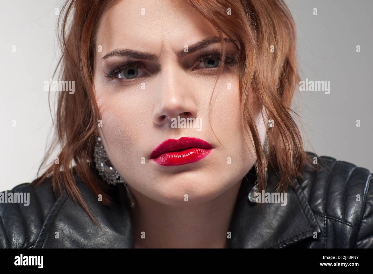 Suspicious look. Aggressive confident lady Stock Photo - Alamy