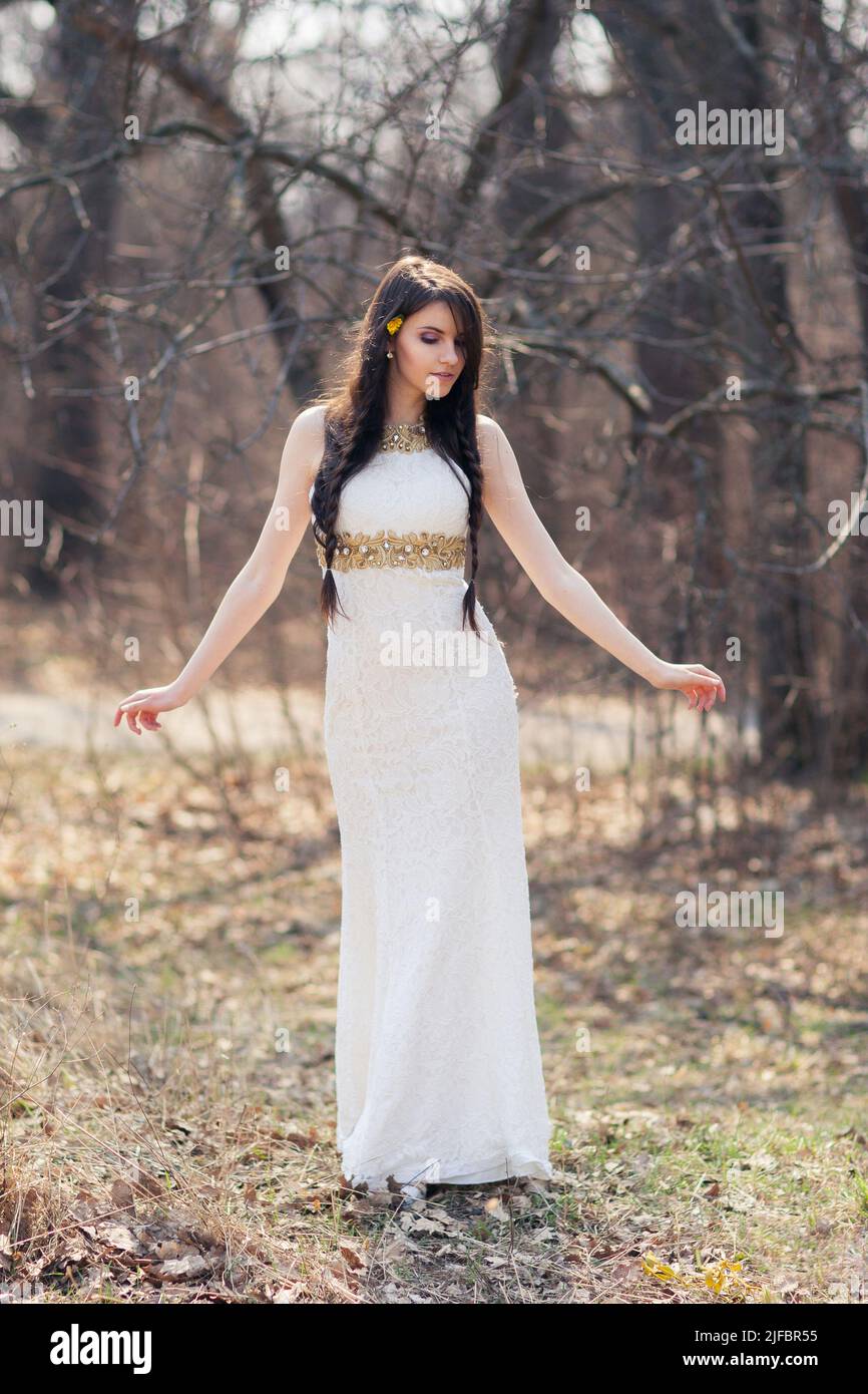 Braided bride at forest on wedding photoshoot Stock Photo - Alamy
