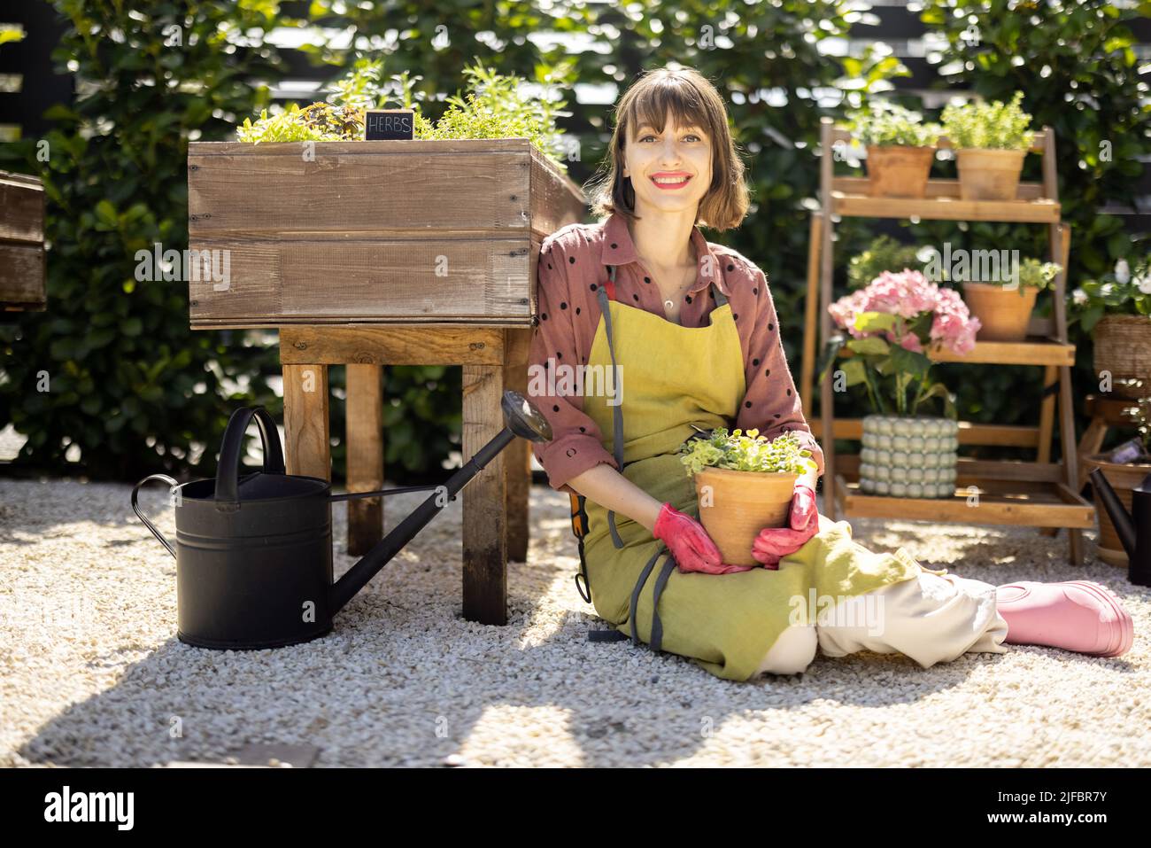 Portrait of young gardener at backyard Stock Photo - Alamy