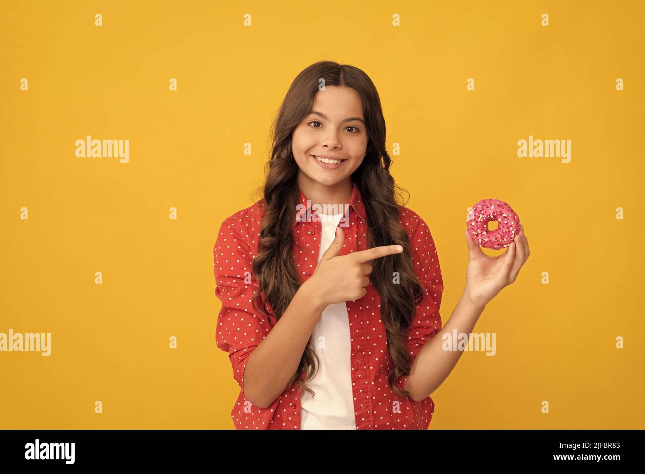 happy kid point finger on sweet glazed donut, food Stock Photo - Alamy