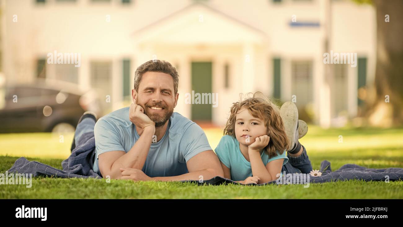fathers day. friendly father and son having fun in park. family value ...