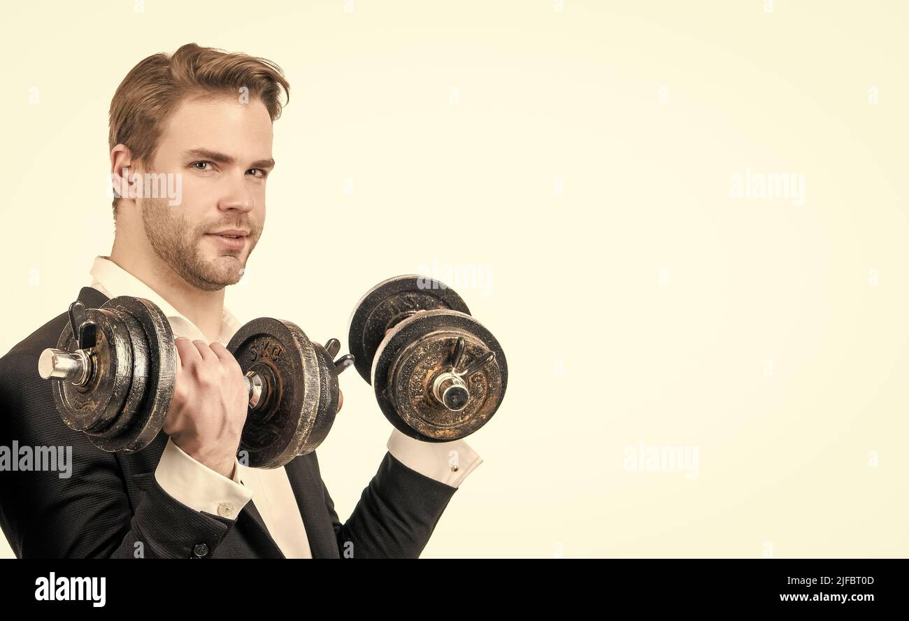 Strong man employee do dumbbell exercise using hand weights, business ...