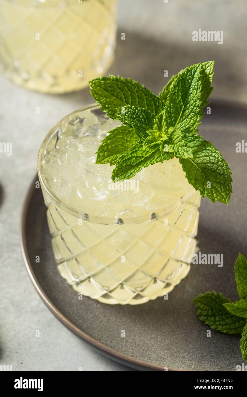 Cold Boozy Refreshing Whiskey Smash Cocktail with Mint Stock Photo - Alamy