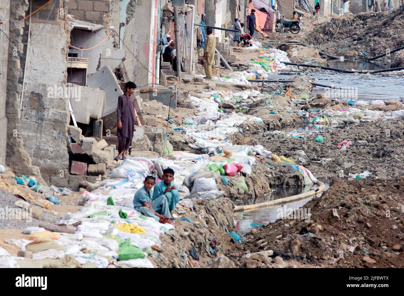 Karachi, Pakistan. 01st July, 2022. View of open sewerage and rain ...