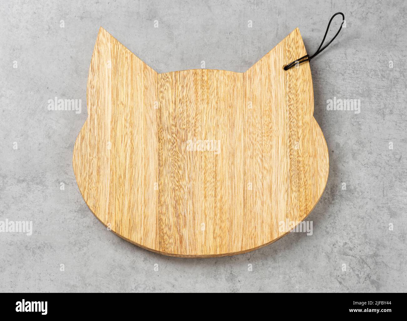 Hand made wooden chopping board in the shape of a cat's head Stock ...