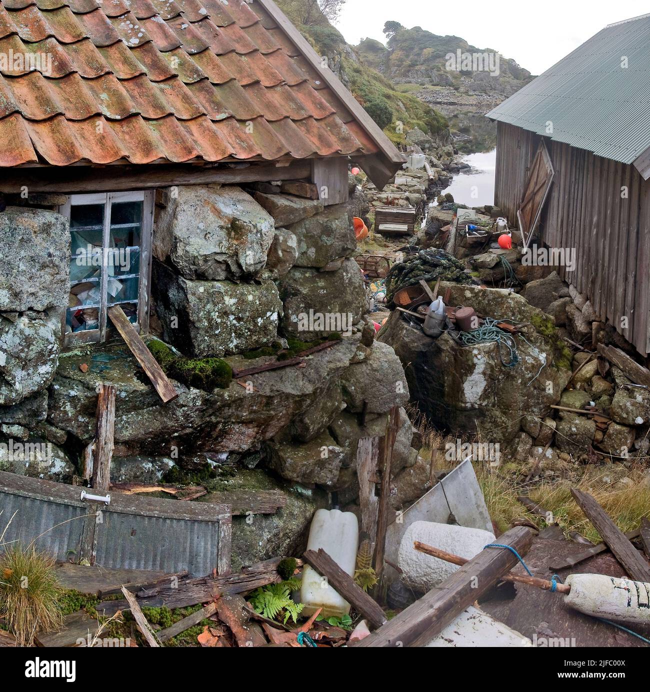 Messy fishing-tackle after the storm outside an old Norwehian boat ...
