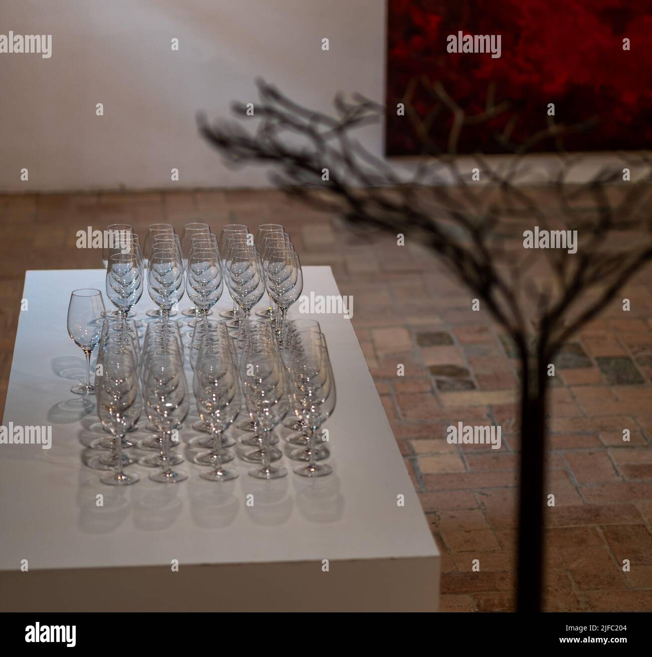 sparkling crystal wine glasses arranged in a row on a table with a ...