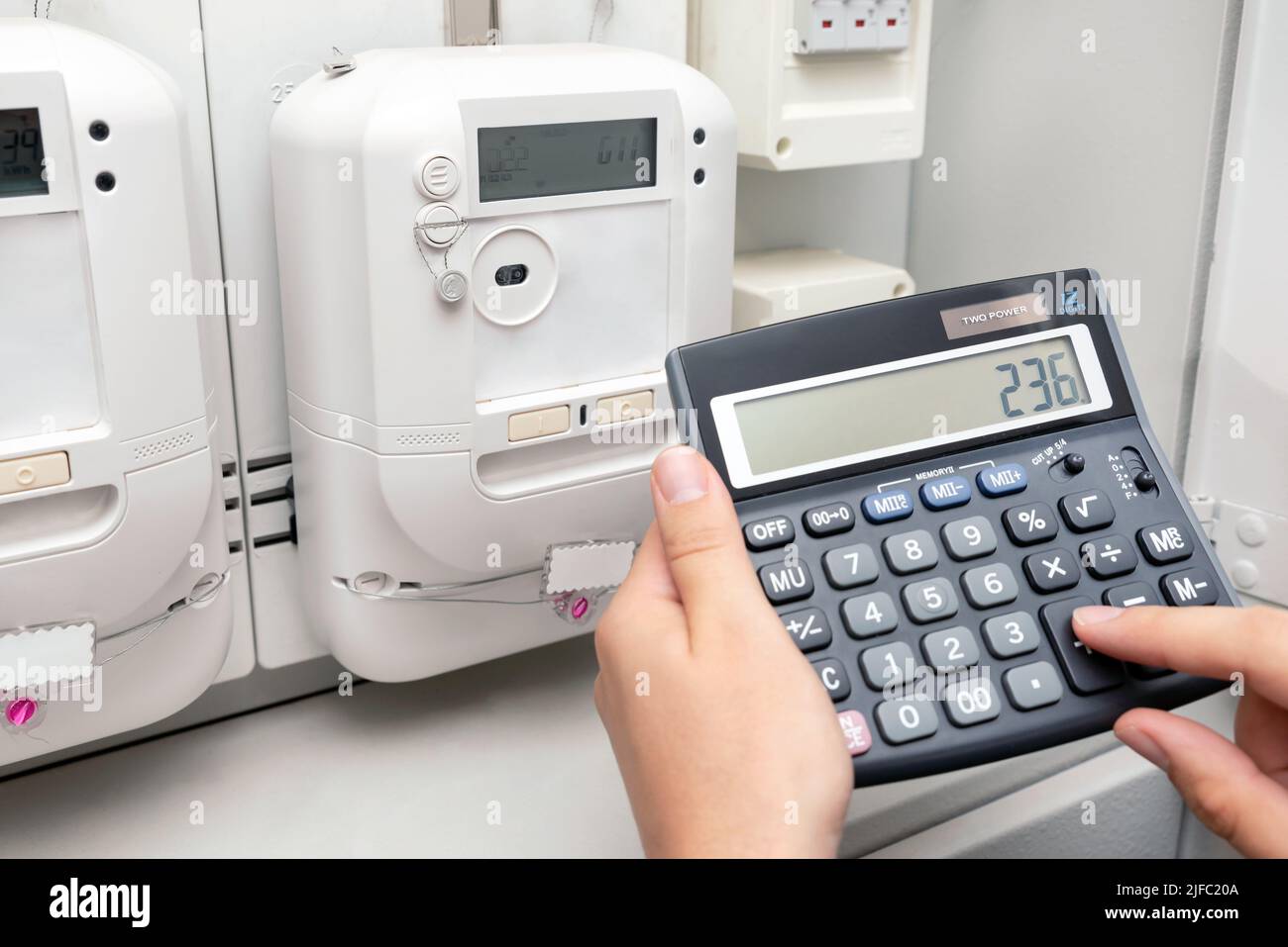 Man with calculator and energy electric meter Energy efficient, rising ...