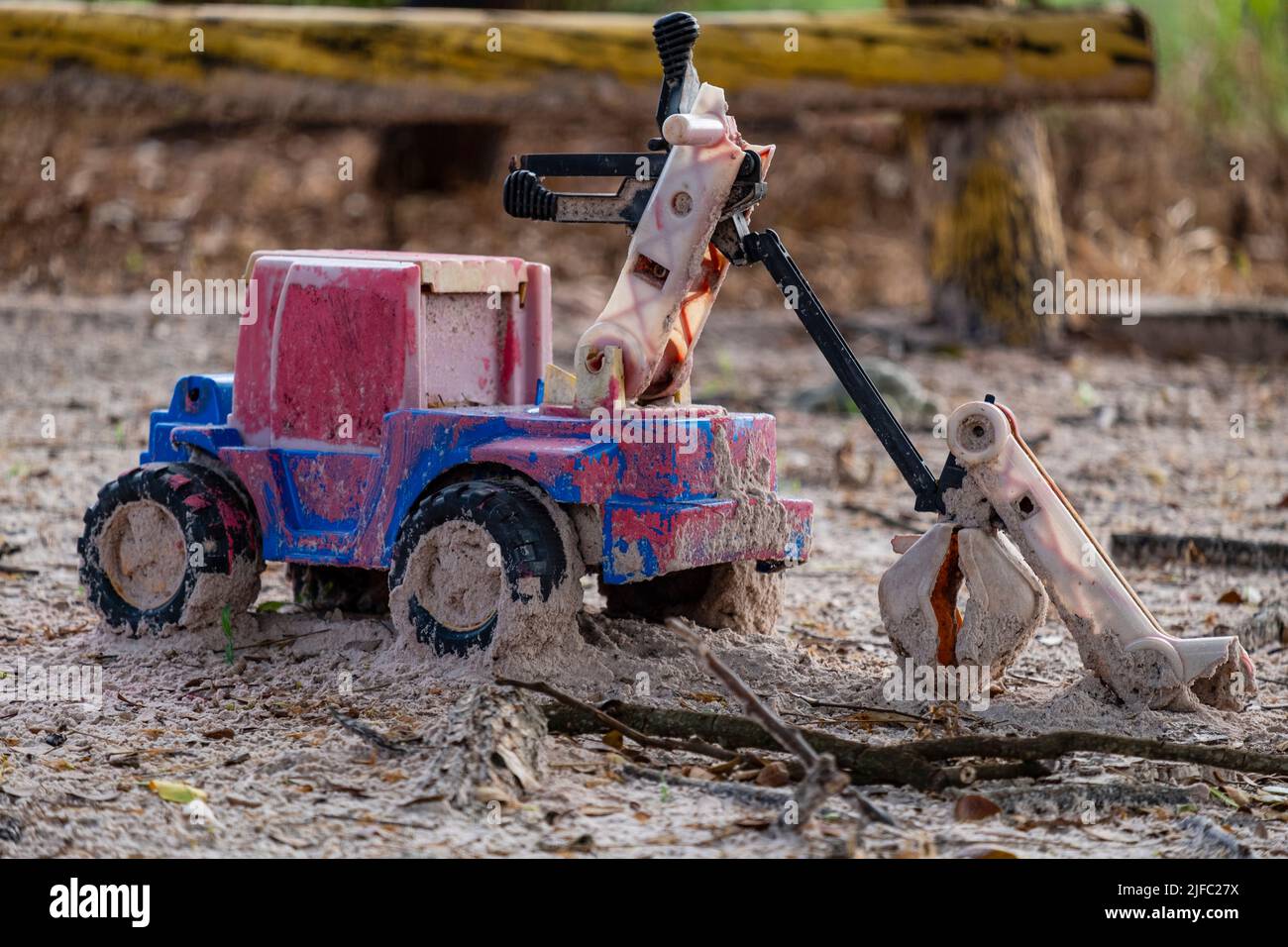 plastic toy car damaged and abandoned in sand Stock Photo - Alamy