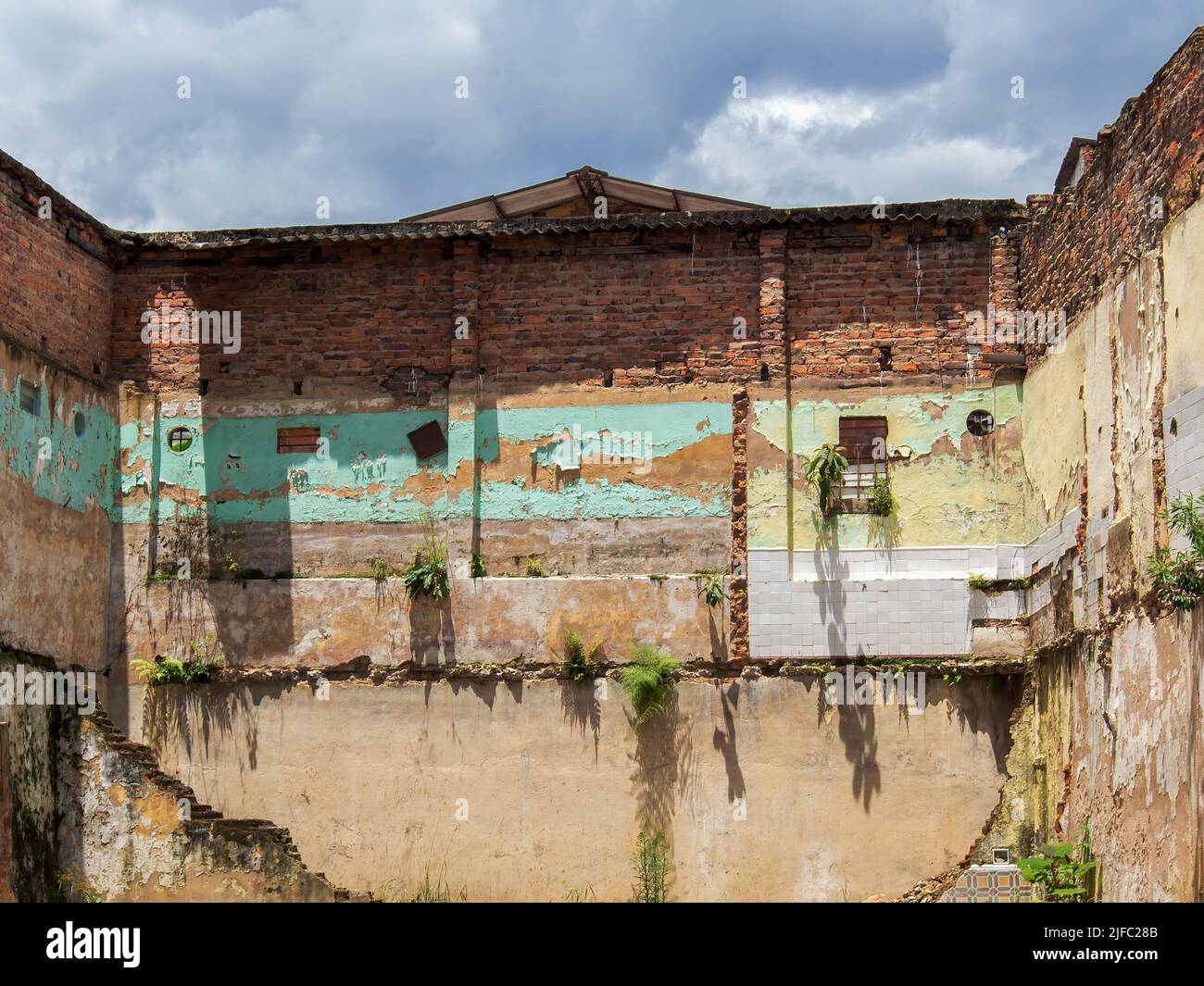 View of the remain brick walls and stairs of a demolished house in the ...