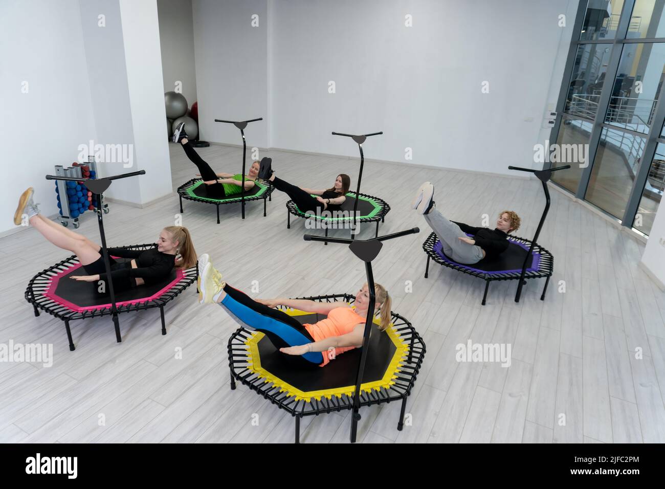 Lie down trampoline active fitness group center friends youth athlete ...