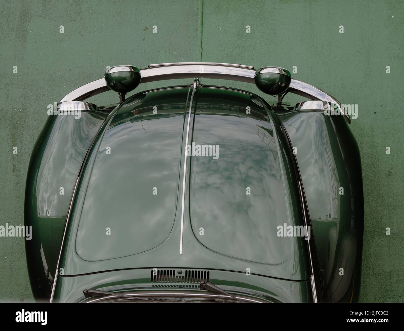 Green car hood top view. Close-up. Green car on a green background ...