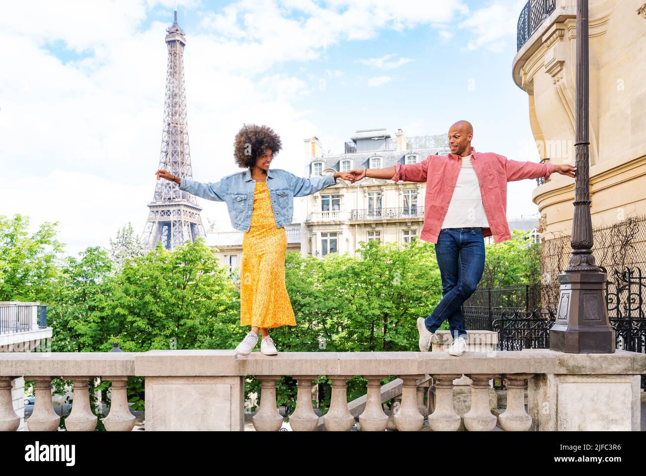 Black cheerful happy couple in love visiting Paris city centre and ...