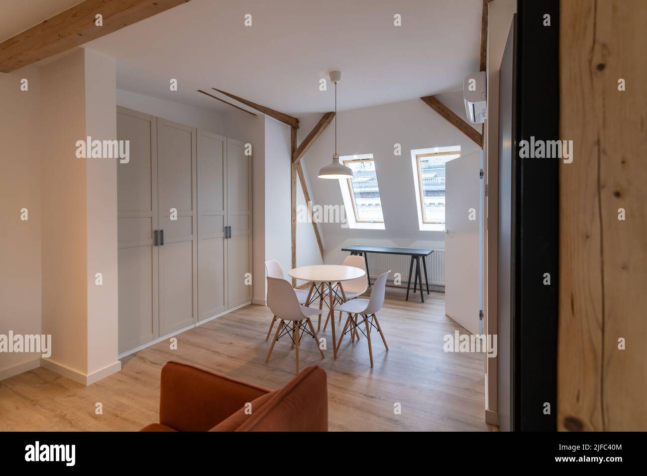 Salmon-colored sofa in a modern living room Stock Photo - Alamy